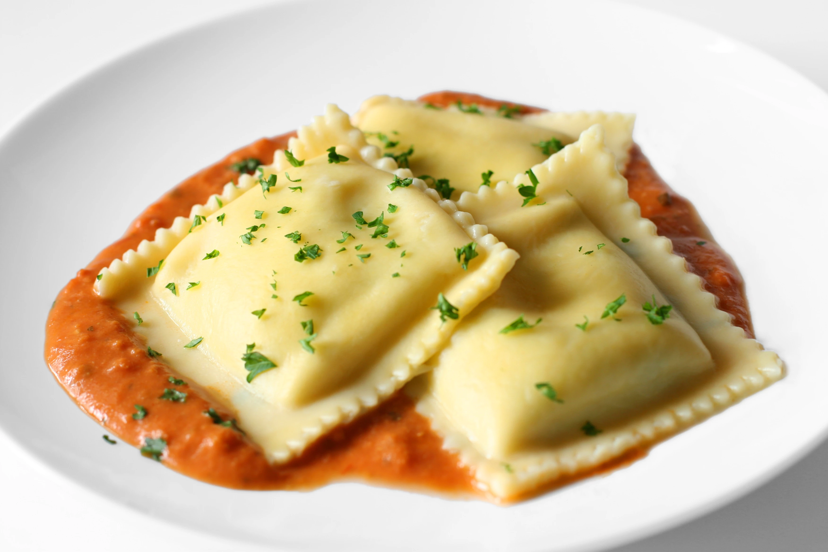Prawn and salt cod ravioli with yellow pepper romesco sauce Recipe ...
